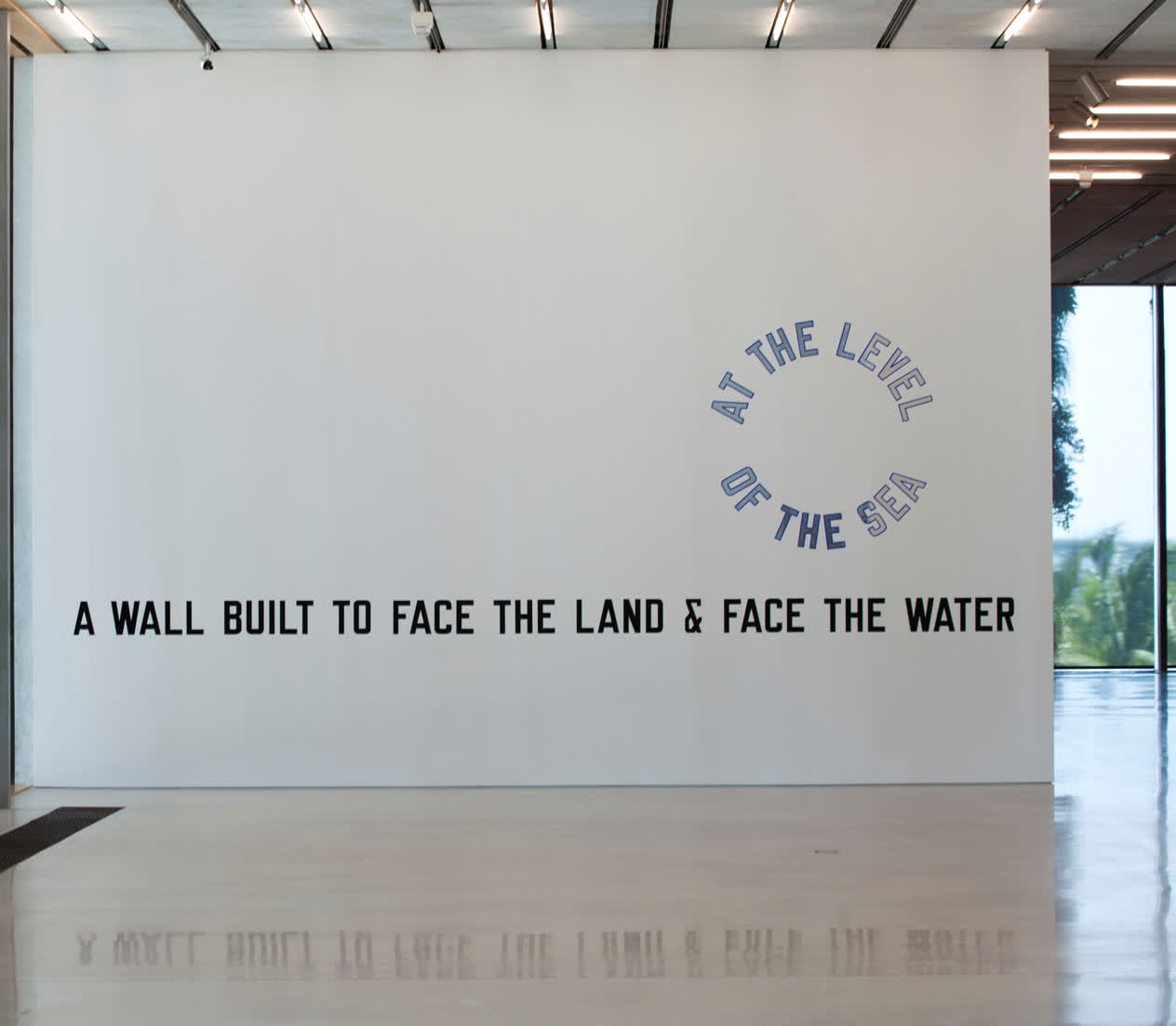 A WALL BUILT TO FACE THE LAND & FACE THE WATER AT THE LEVEL OF THE SEA ...